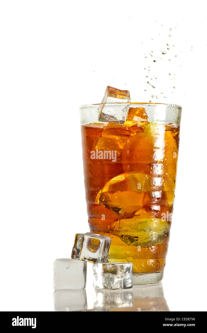 Ice tea with splash in glass Stock Photo - Alamy