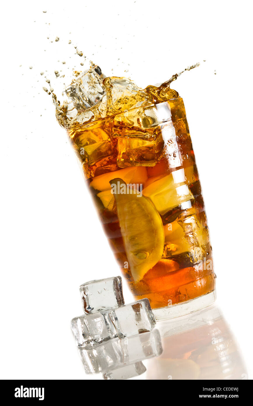 Ice splash in a glass with lemon tea Stock Photo - Alamy