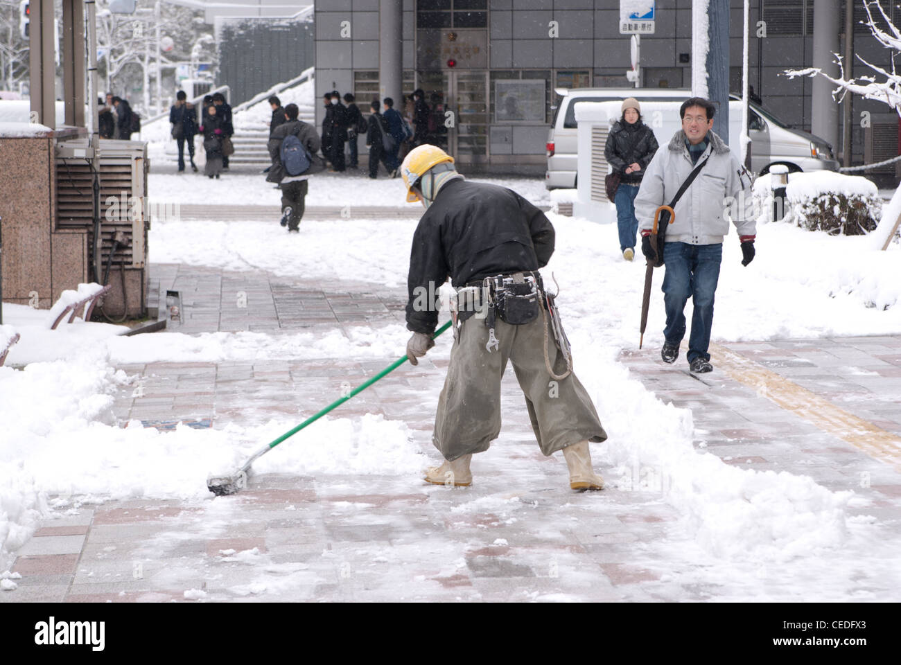 Man clearing path in snow hi-res stock photography and images - Alamy