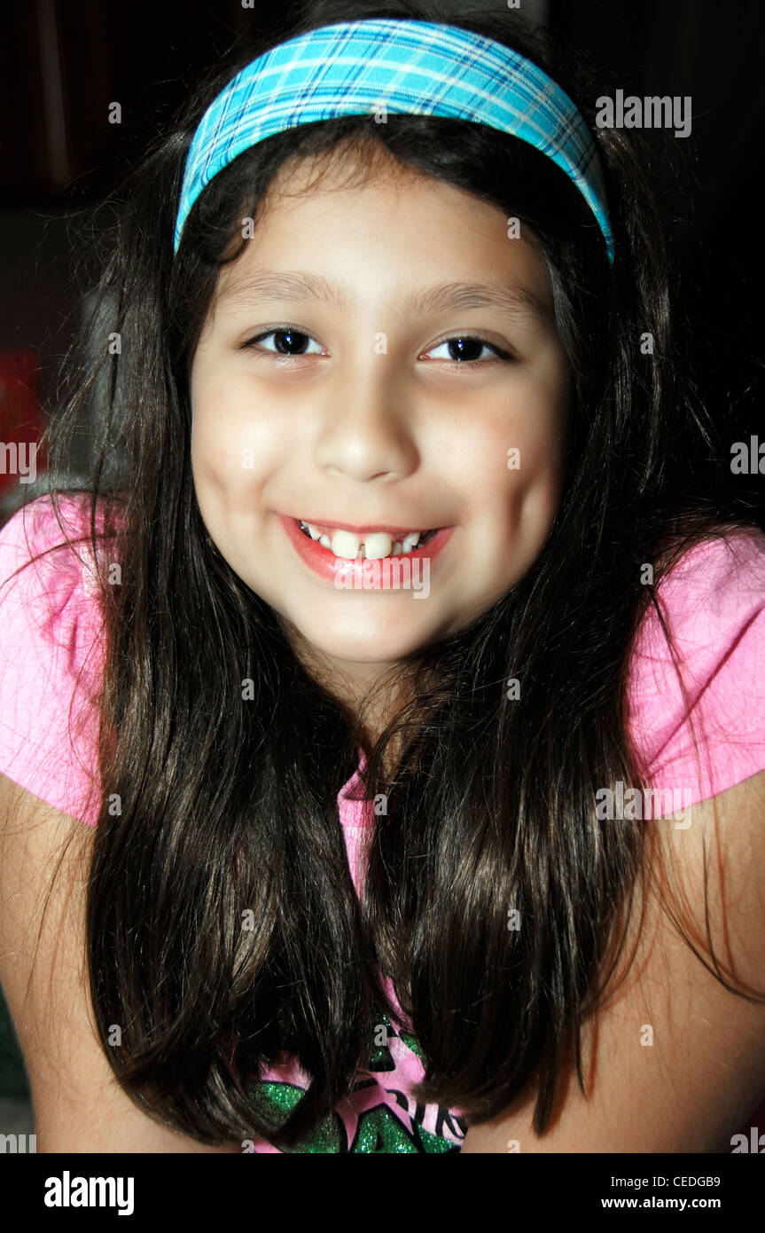 A young smiling Latin American Hispanic girl Stock Photo - Alamy
