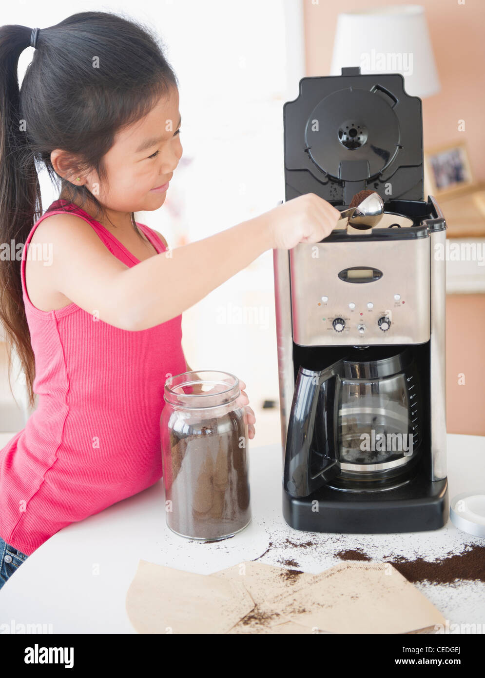 Korean girl making coffee Stock Photo - Alamy