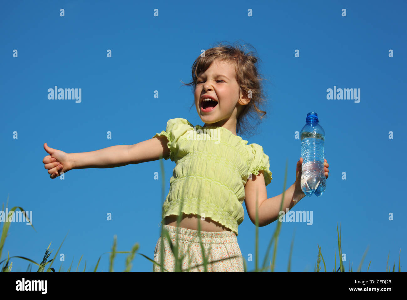 Girl screaming in grass hi-res stock photography and images - Alamy
