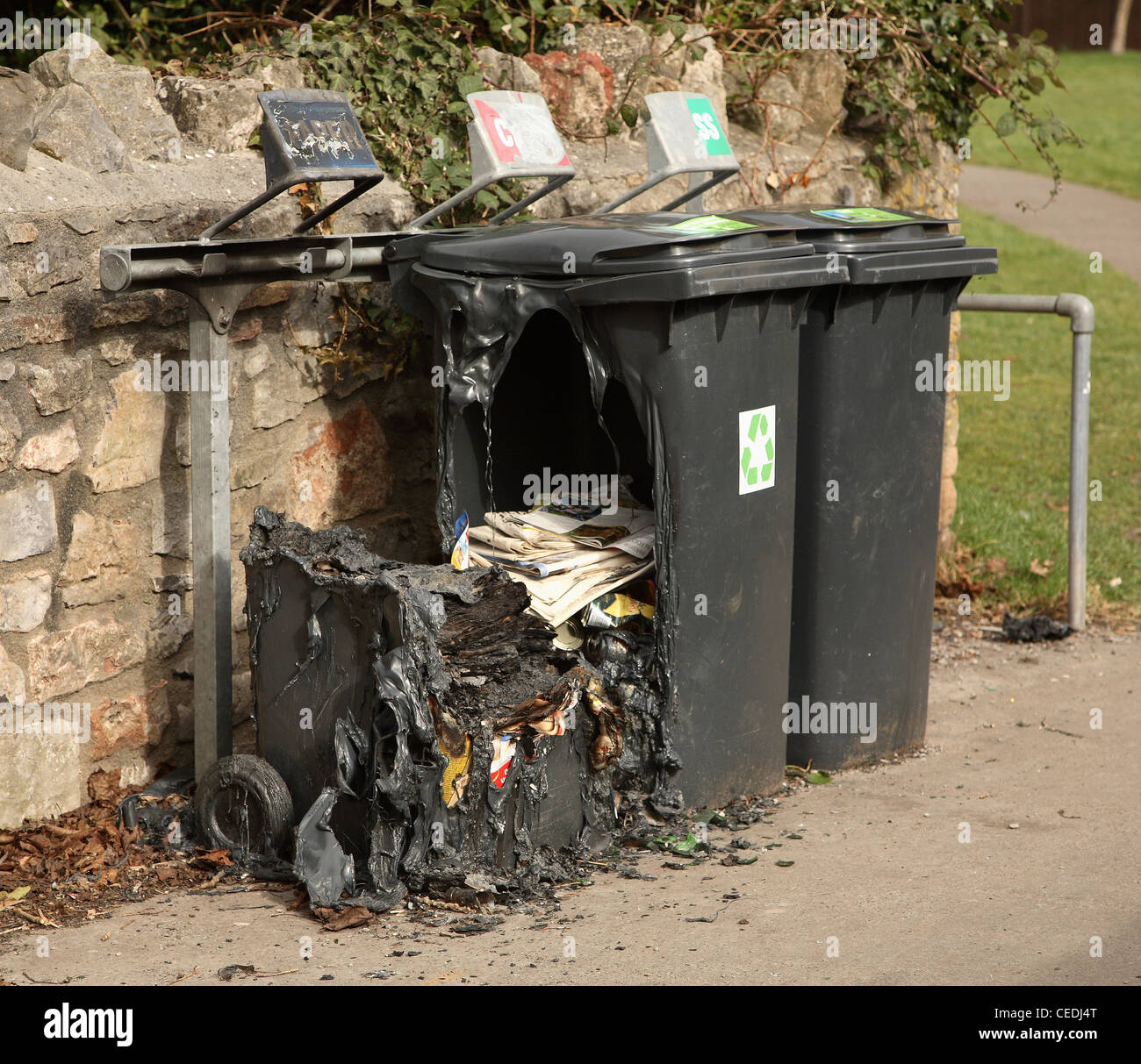 Burnt re cycling bins Stock Photo - Alamy