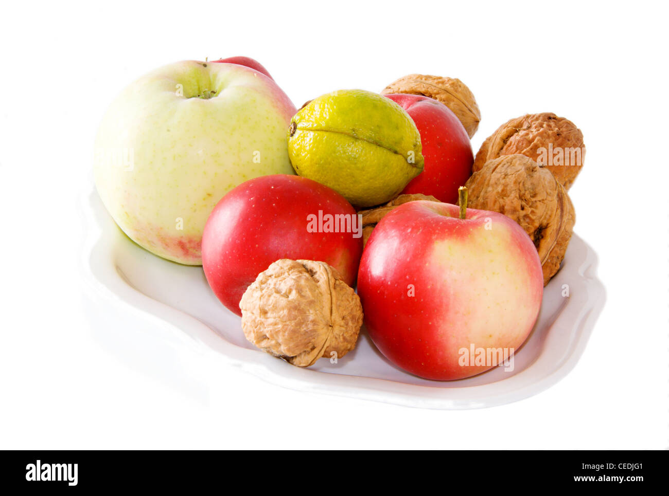 Autumn fruits in white plate Stock Photo - Alamy