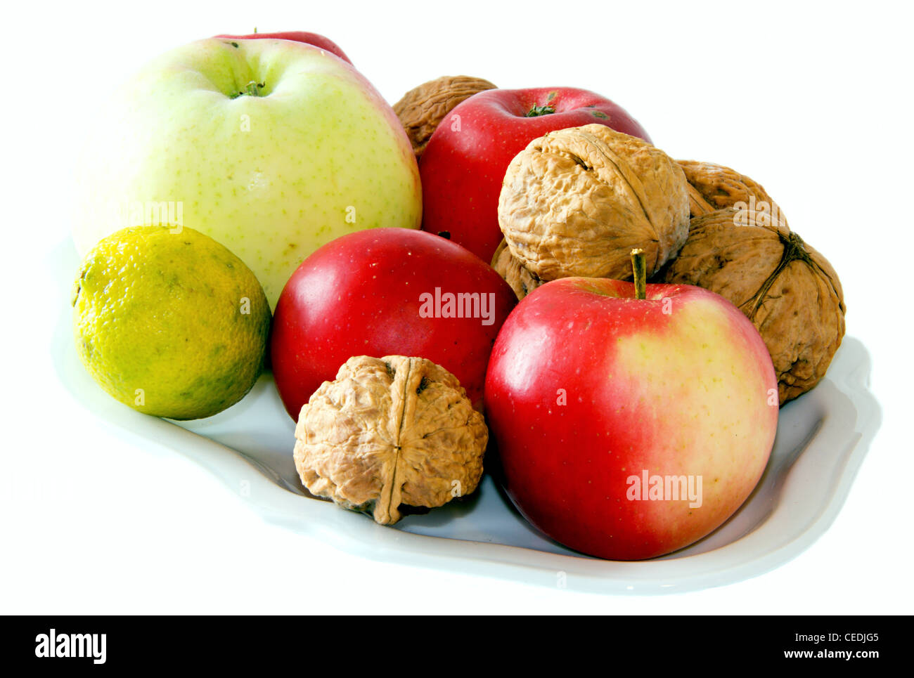 Autumn fruits in white plate Stock Photo - Alamy