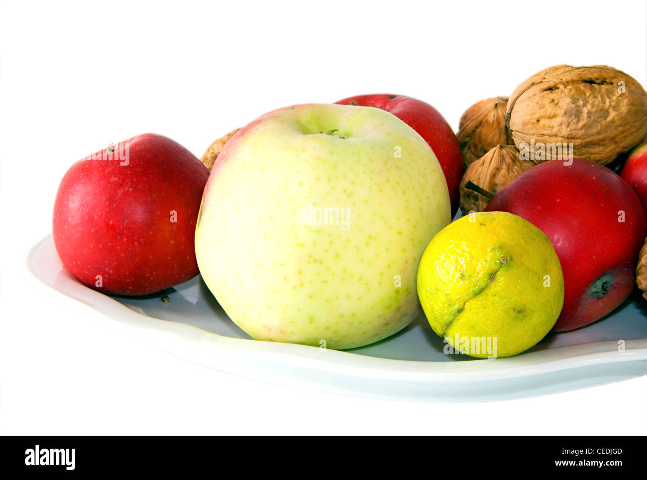 Autumn fruits in white plate Stock Photo - Alamy