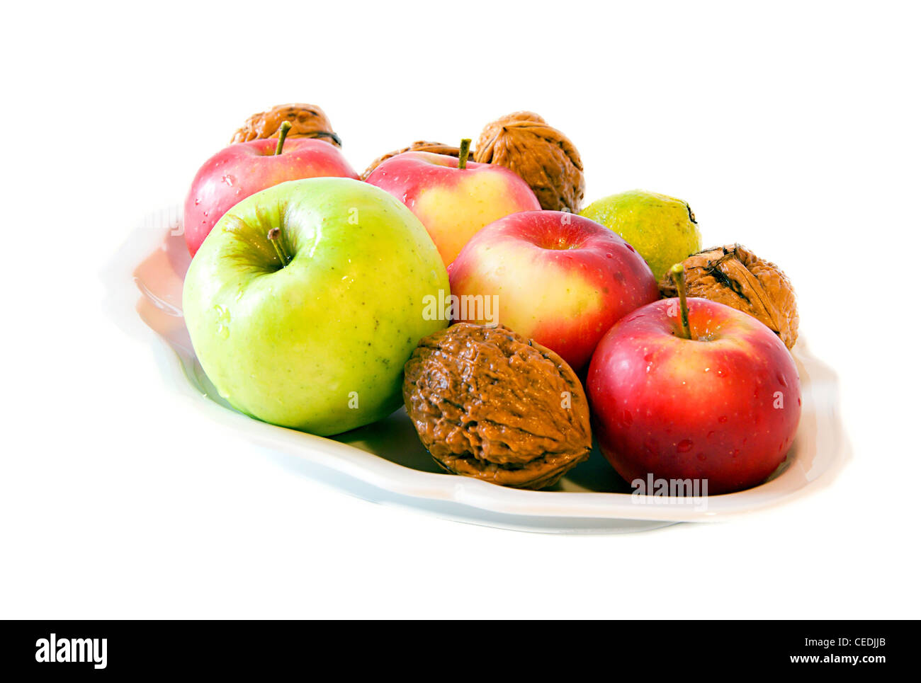 Autumn fruits in white plate Stock Photo - Alamy