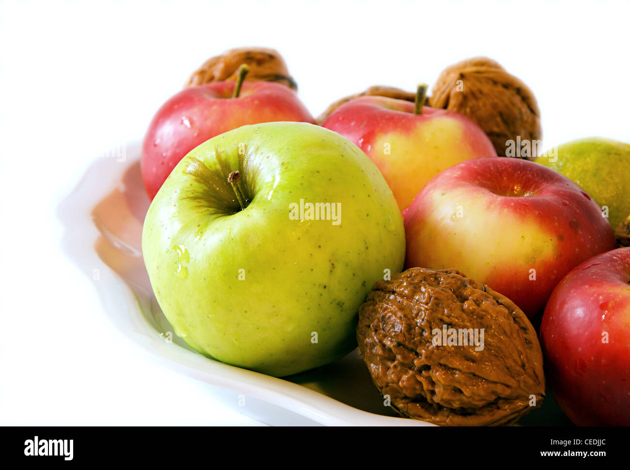 Autumn fruits in white plate Stock Photo - Alamy