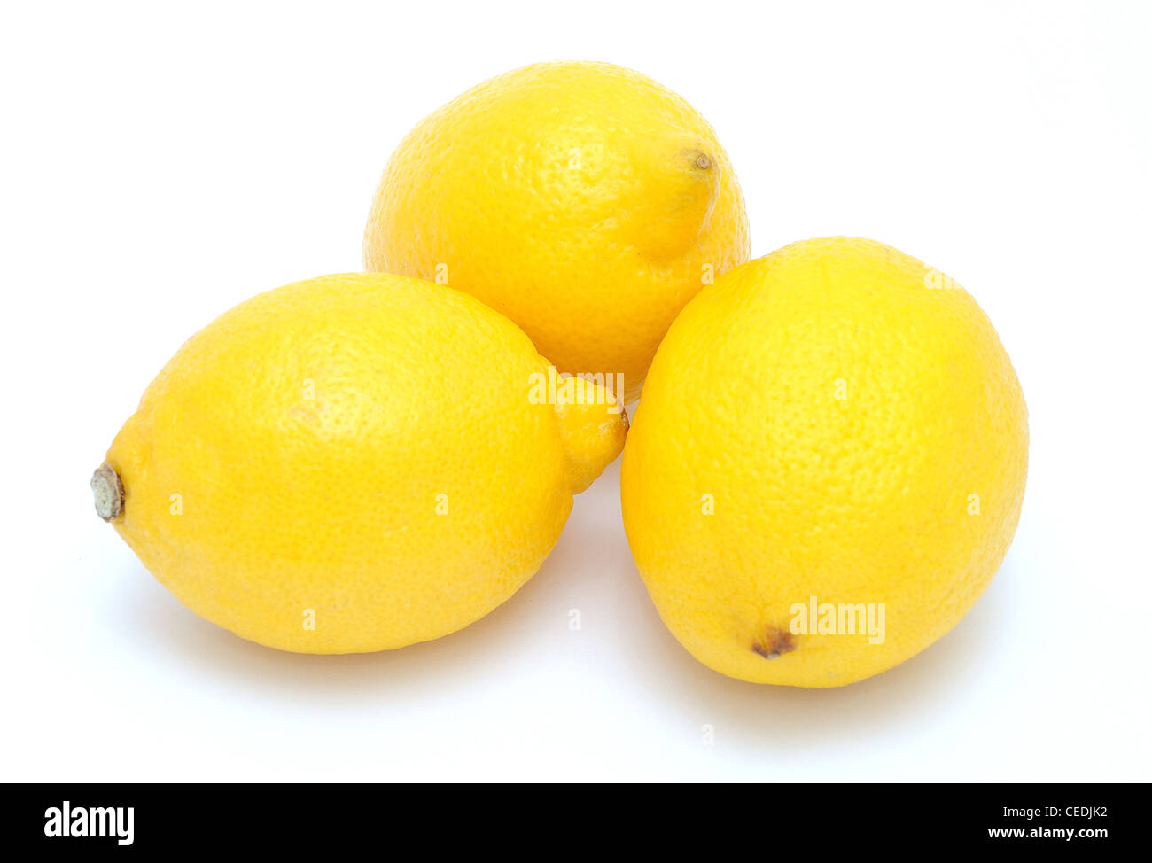 Three lemons placed on the white background Stock Photo - Alamy