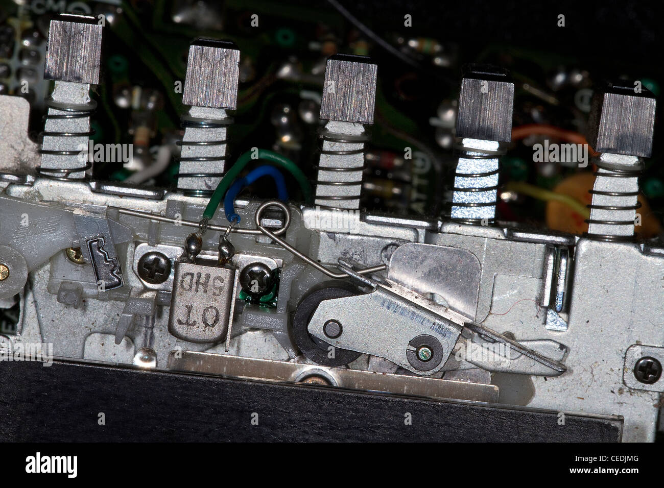 Part of the control system in a miniature tape recorder and player ...