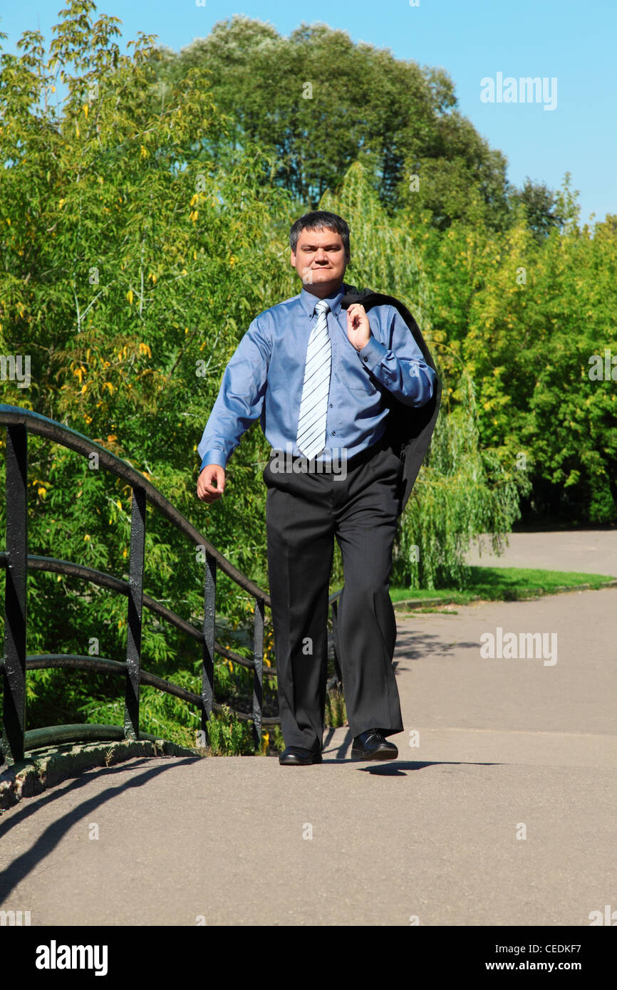 businessman walks outdoor in summer Stock Photo - Alamy