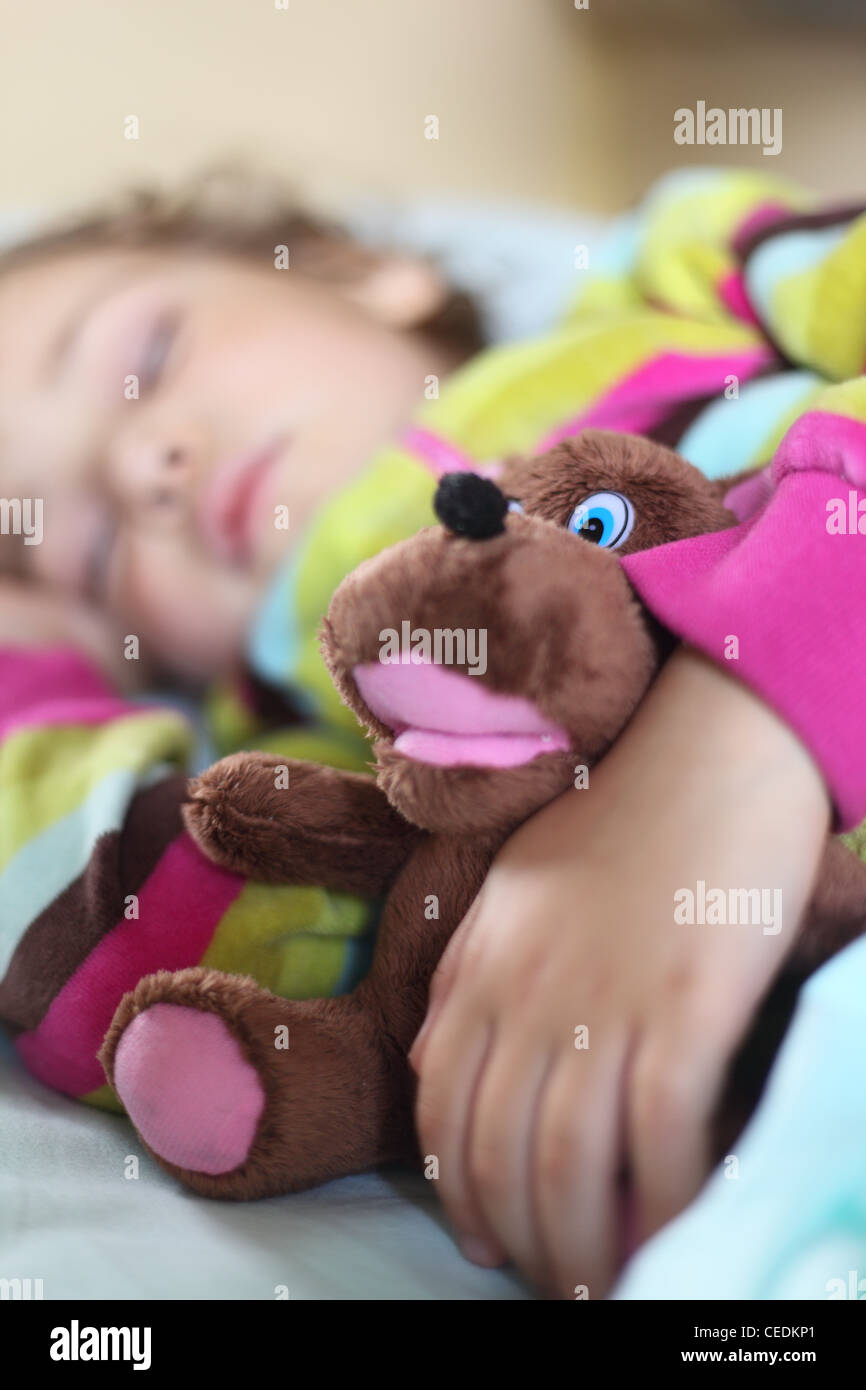 little girl sleeps in train with puppet Stock Photo - Alamy