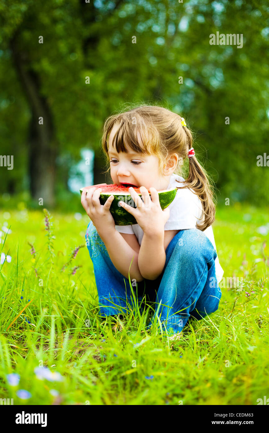 happy girl eating water melon Stock Photo - Alamy
