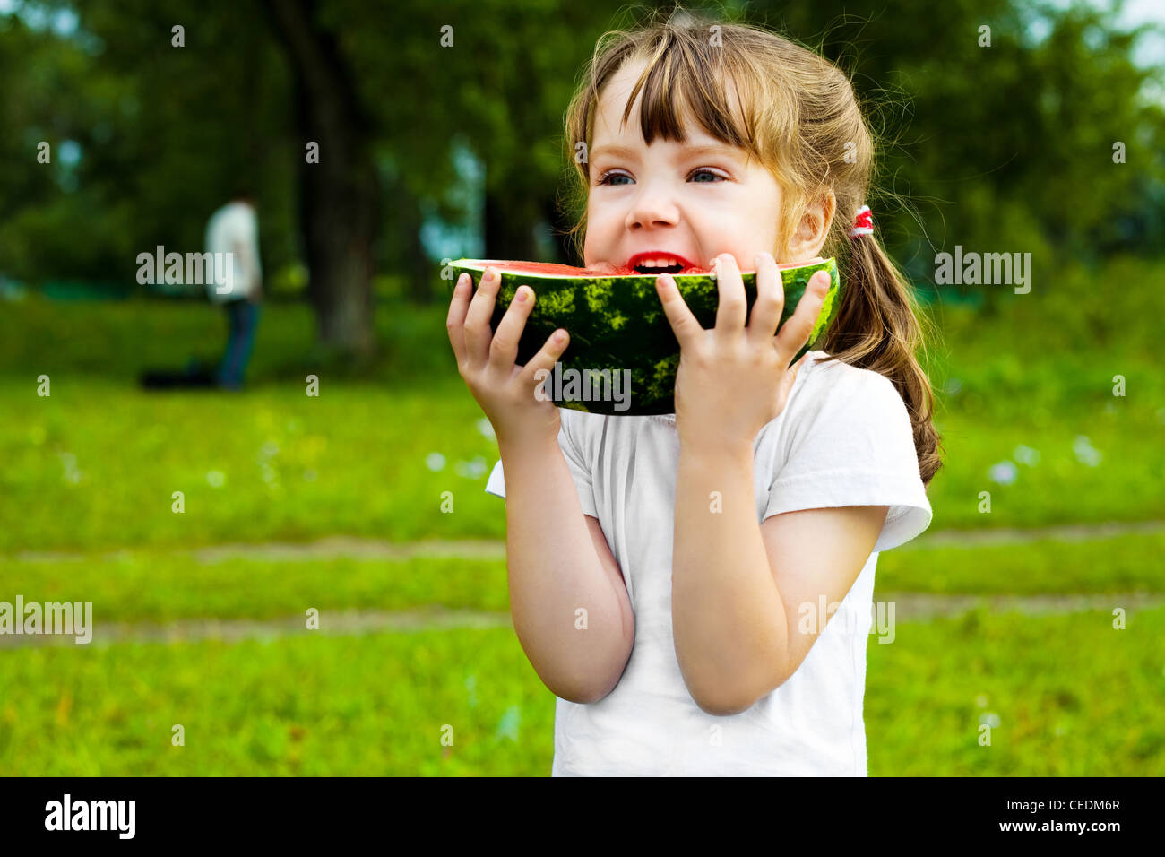 happy girl eating water melon Stock Photo - Alamy
