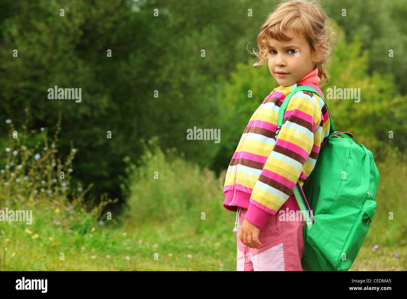 little girl with backpack outdoor in summer Stock Photo - Alamy
