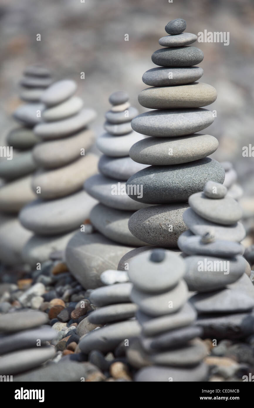 many stone stacks on pebble beach Stock Photo - Alamy