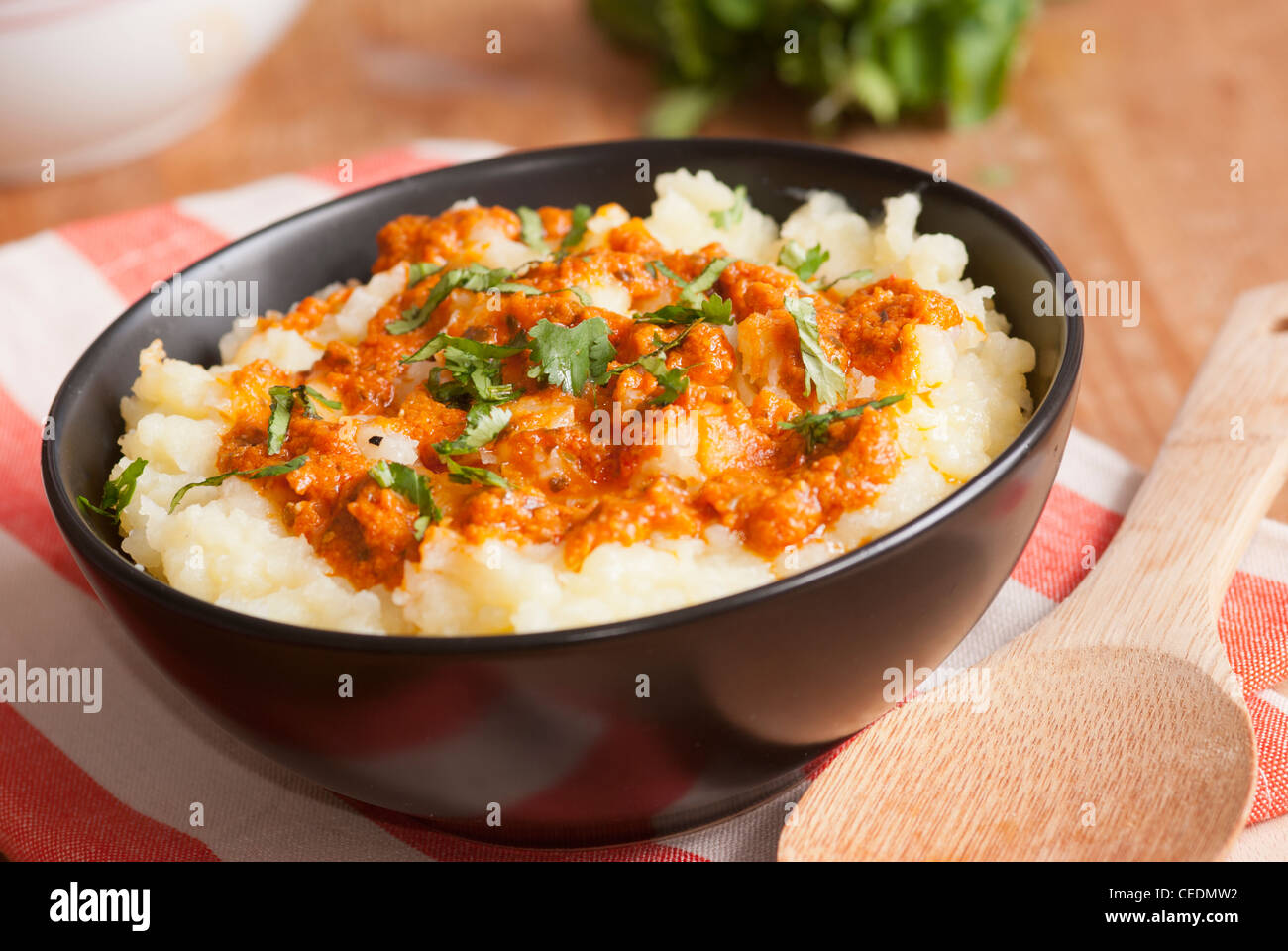 Mashed potatoes with sun dried tomato dressing Stock Photo - Alamy