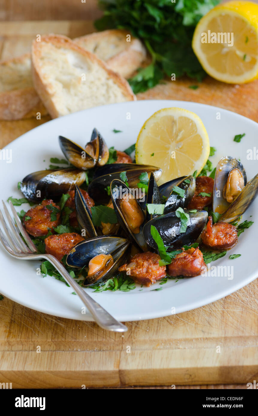 Mussels and Chorizo in white wine sauce Stock Photo - Alamy