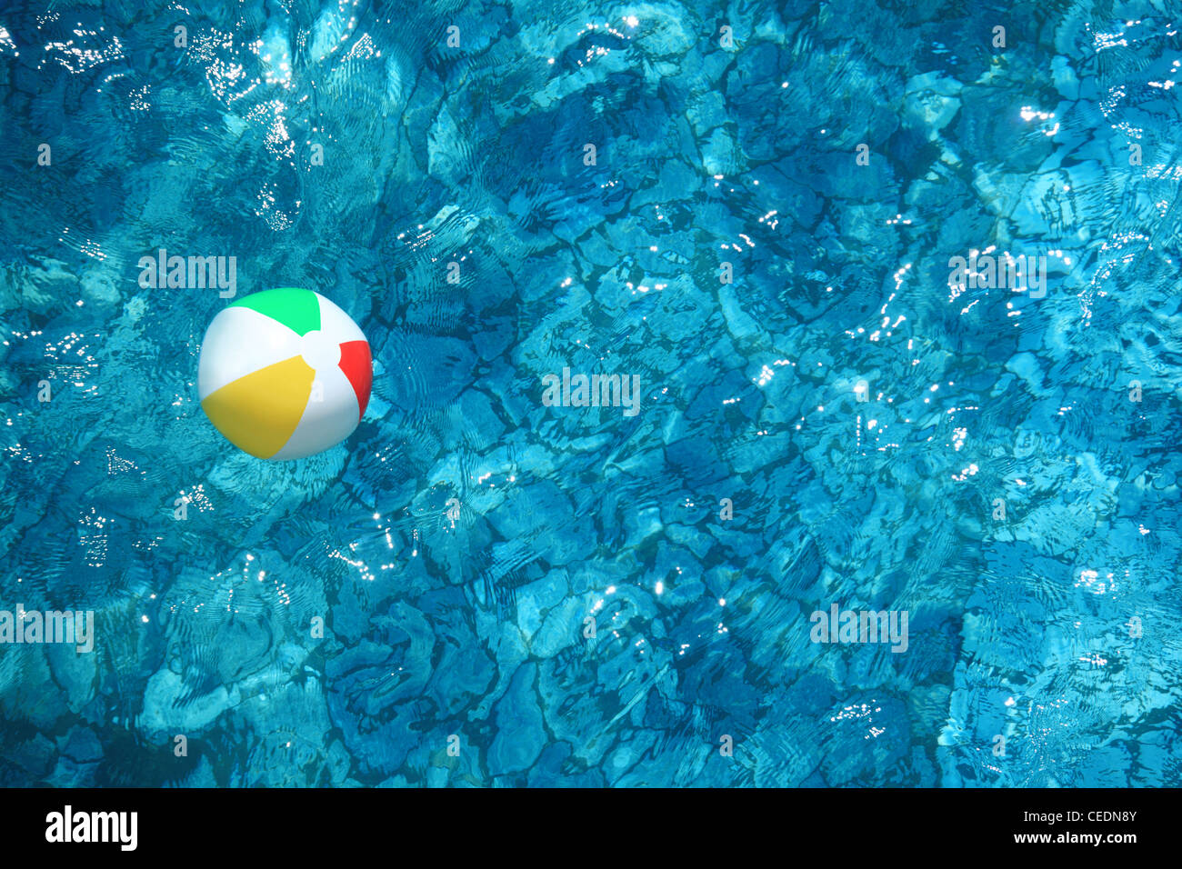 Children's ball in water pool Stock Photo - Alamy