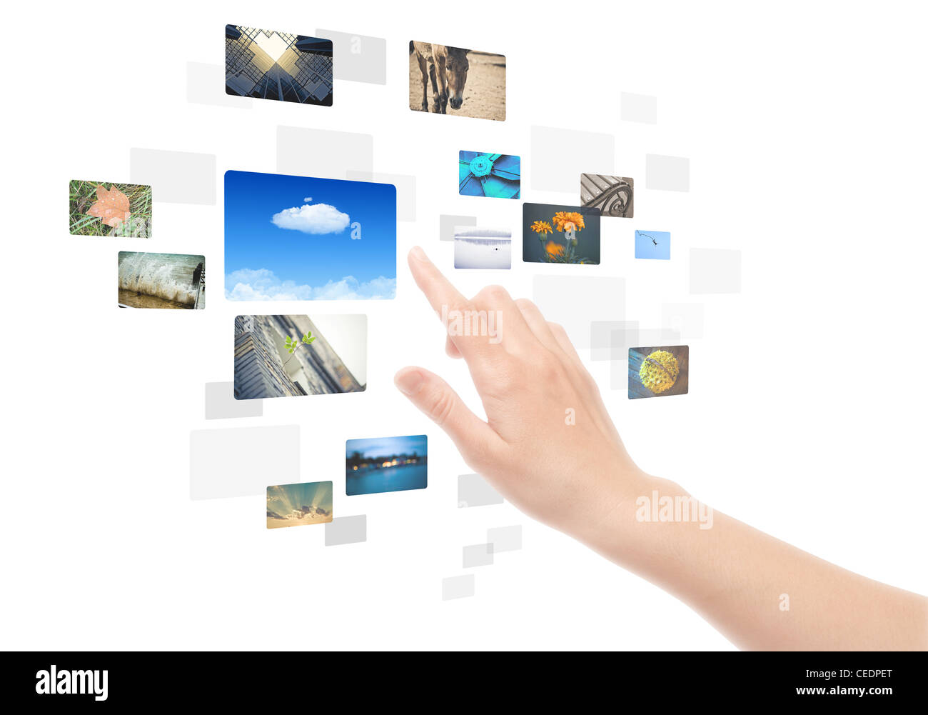 Woman hand using touch screen interface with pictures in frames ...