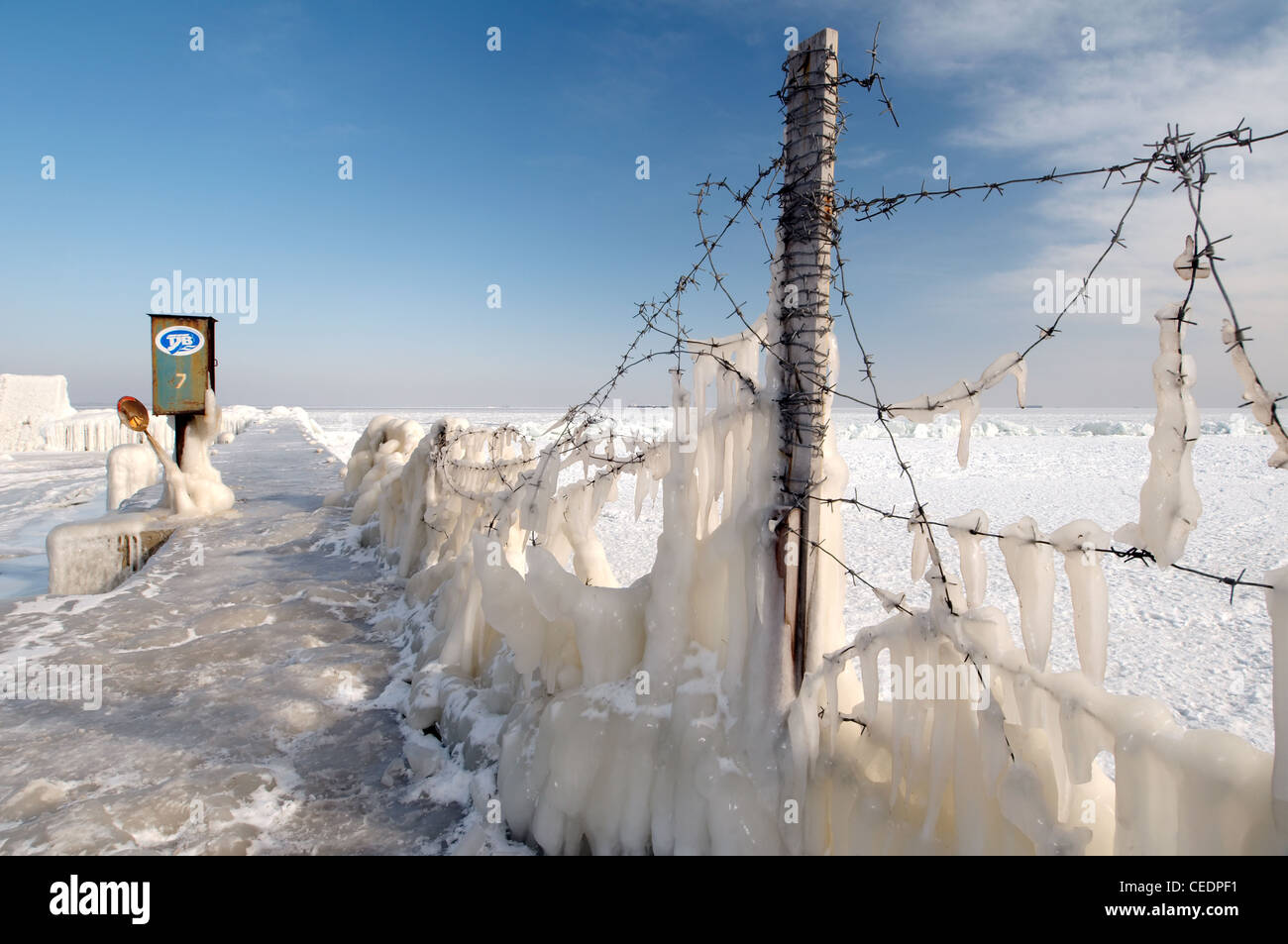 Icy, rusty box and sign, frozen Black Sea, a rare phenomenon, Odessa ...