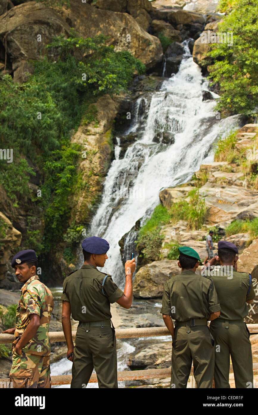Sri Lankan Army soldiers taking photos at Rawana (Ravana) Falls, a popular sight by the highway ...