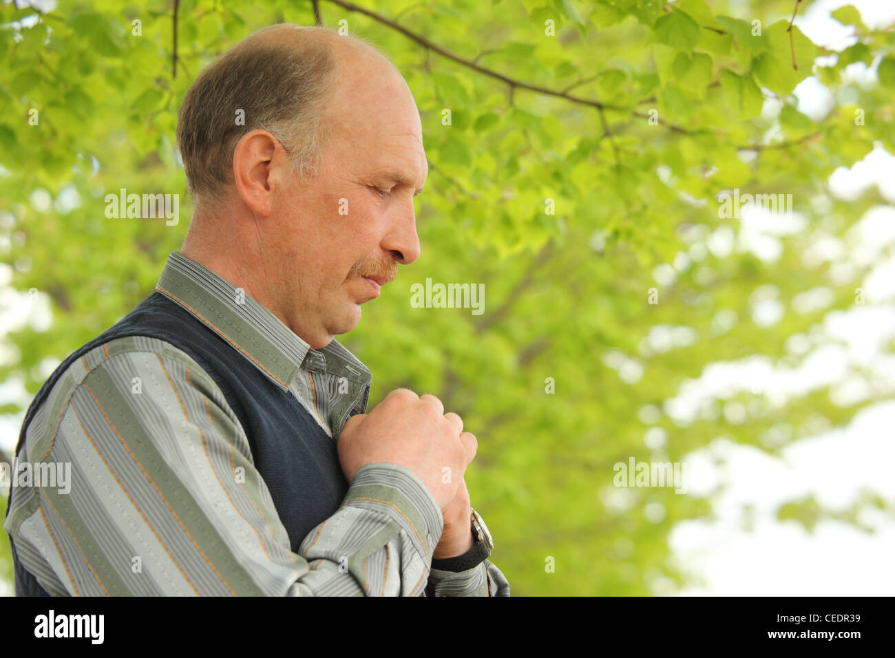 Single man praying hi-res stock photography and images - Alamy