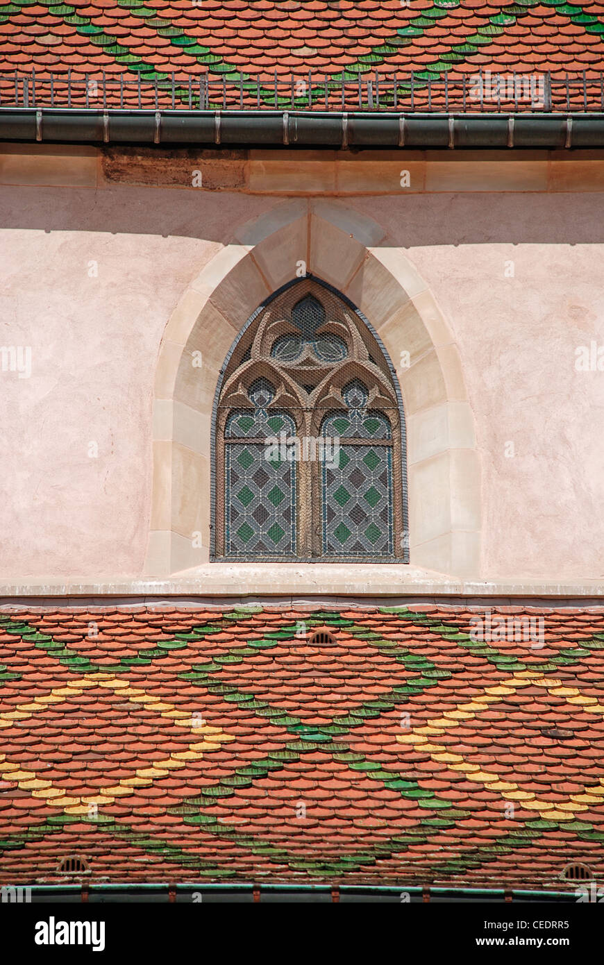 Coloured church roof and window detail hi-res stock photography and ...