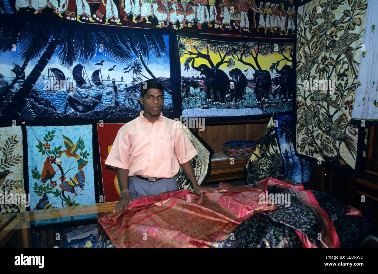 Local vendor of batiks and paintings on silk, market of Kandy, Sri ...