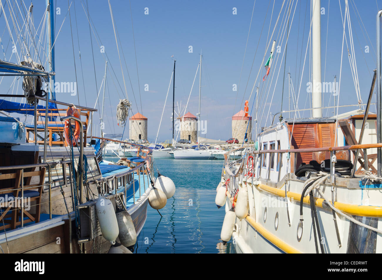 Mandraki Harbour boats and windmills, Rhodes Town, Rhodes Island ...