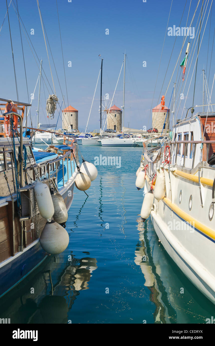 Mandraki Harbour boats and windmills, Rhodes Town, Rhodes Island ...