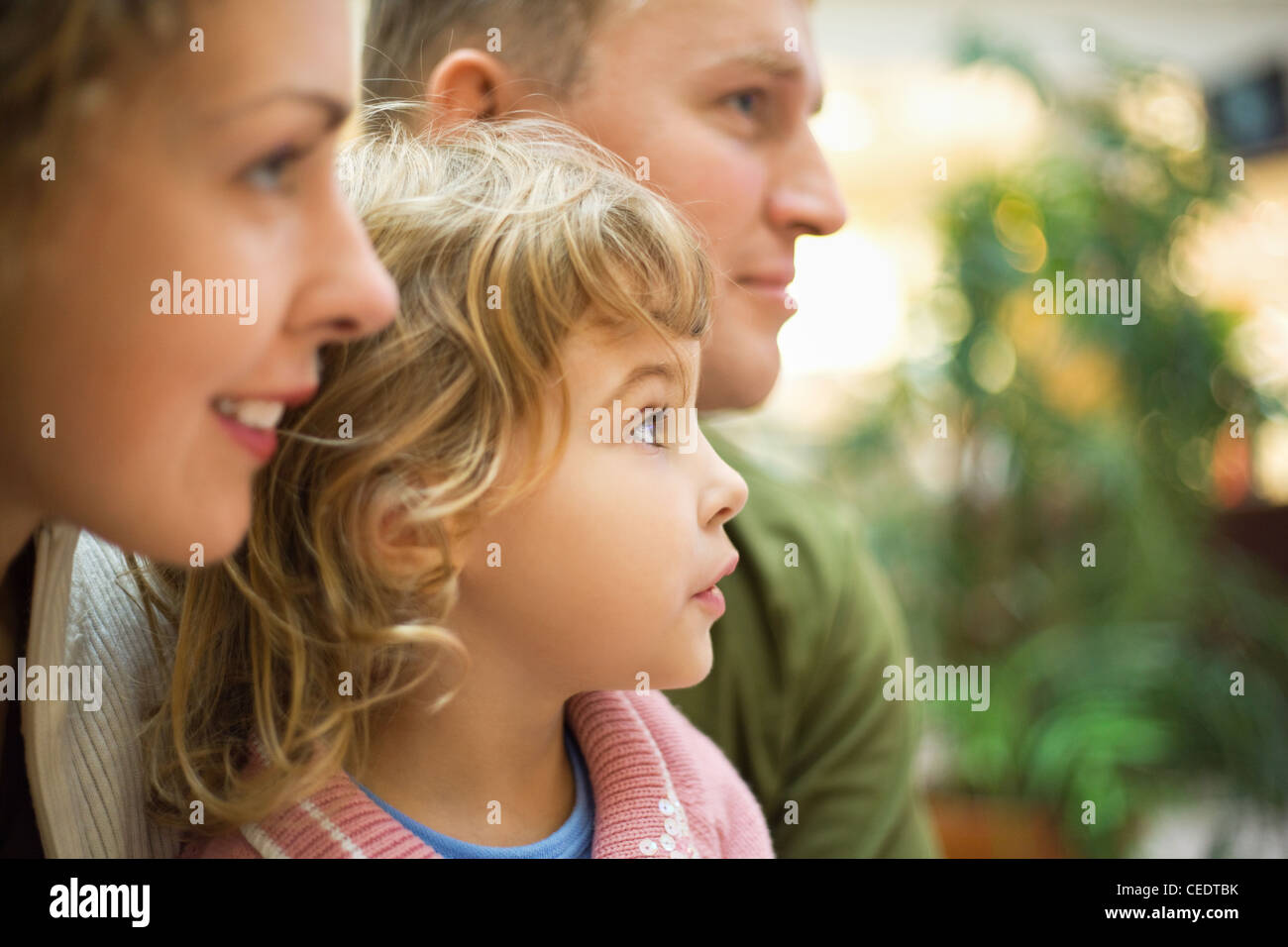 family with girl looking forward Stock Photo - Alamy
