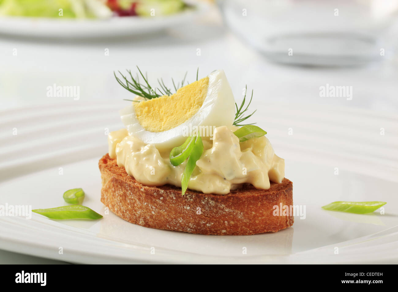 Slice of toasted bread and egg spread Stock Photo - Alamy