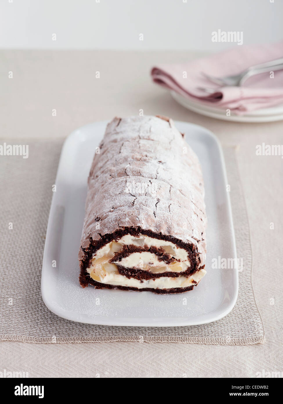 Chocolate and pear meringue roulade Stock Photo - Alamy