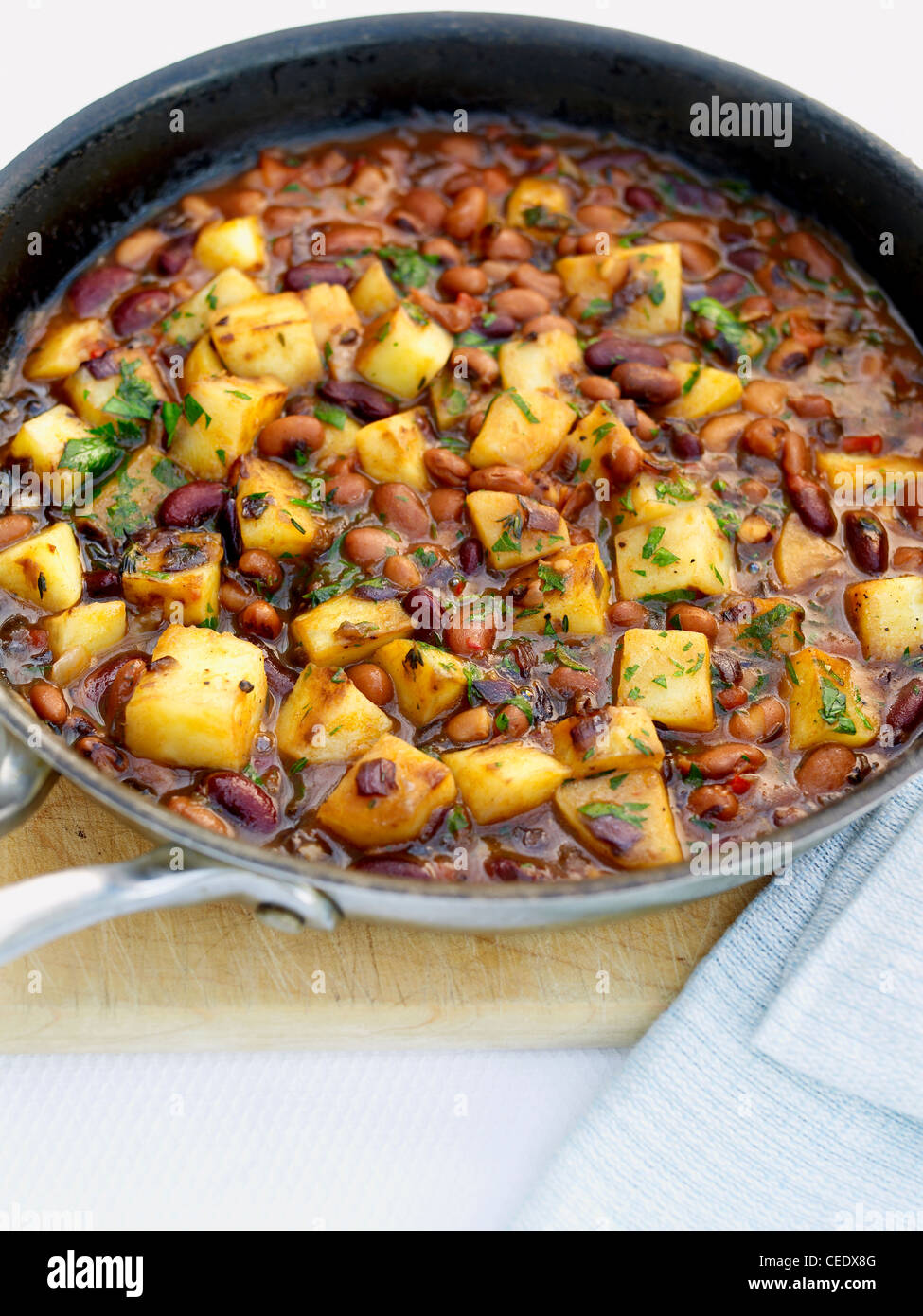 Spiced beans and herb hash Stock Photo - Alamy