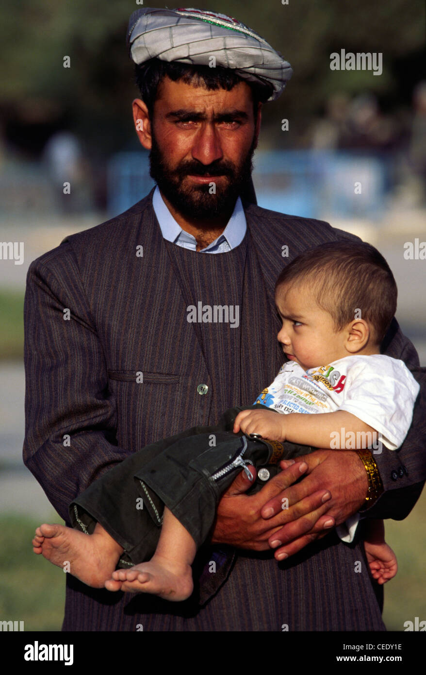 A father holds his child, Mazar-i-Sharif, Afghanistan Stock Photo - Alamy