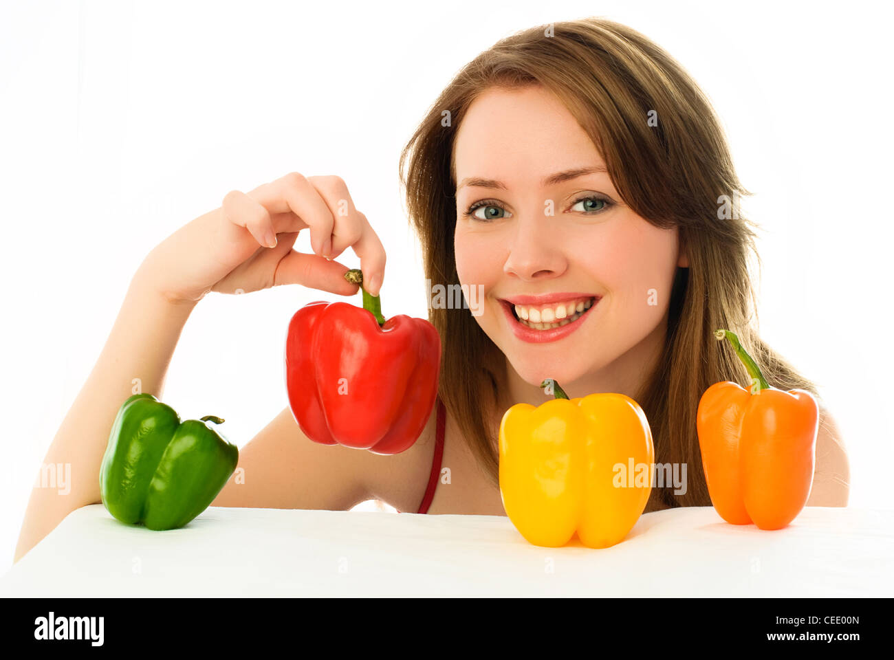 happy woman eating peppers Stock Photo - Alamy