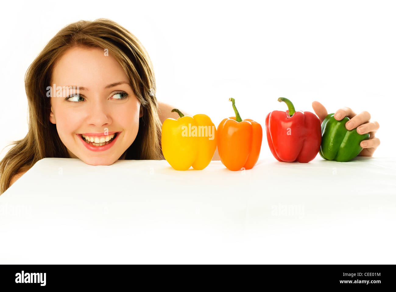 happy woman eating peppers Stock Photo - Alamy