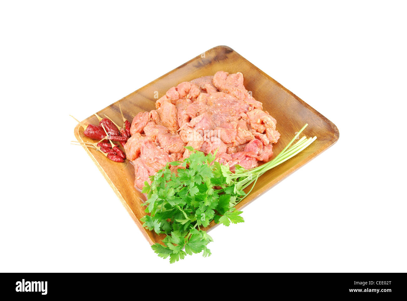 Wooden plate raw pork Cut Out Stock Images & Pictures - Alamy