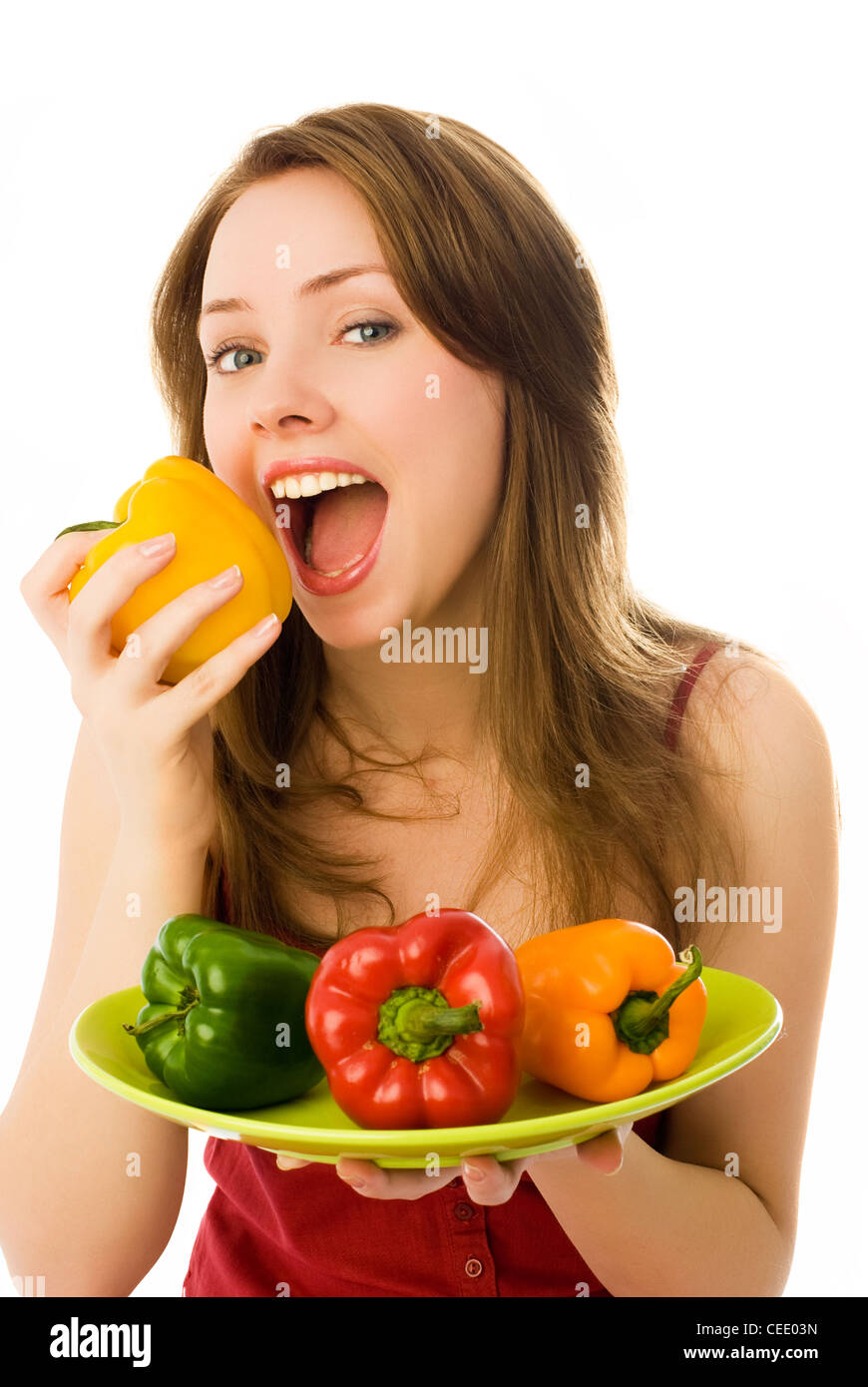happy woman eating peppers Stock Photo - Alamy