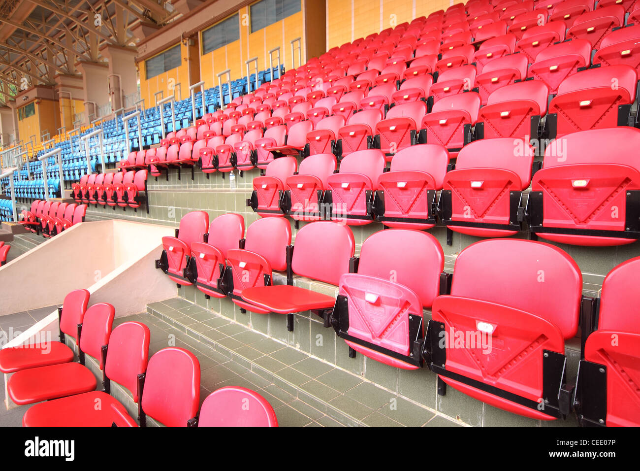 Bright red stadium seats Stock Photo - Alamy