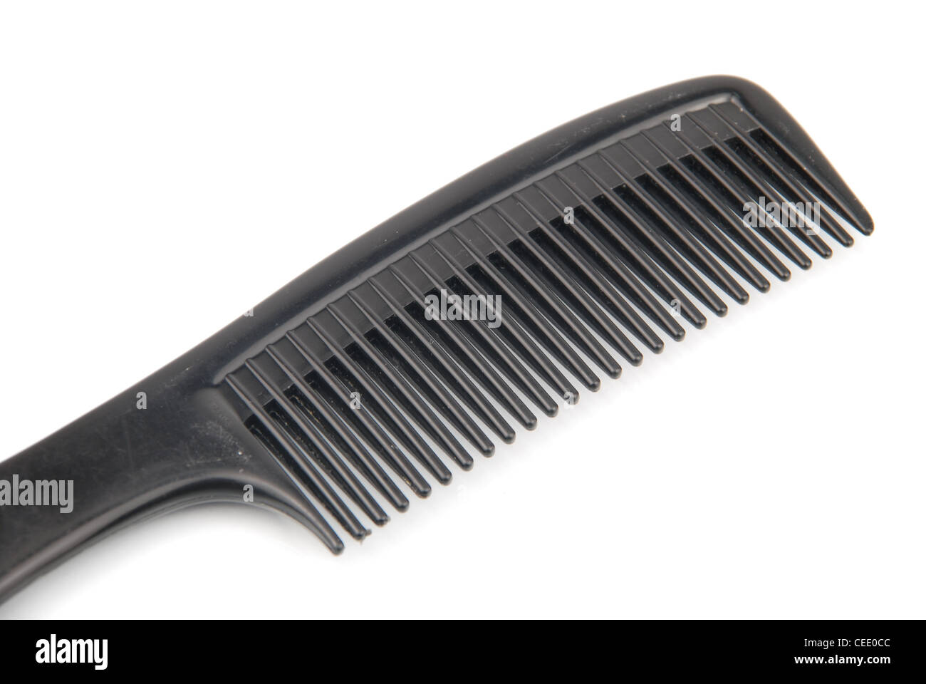 black plastic comb isolated on white background Stock Photo - Alamy