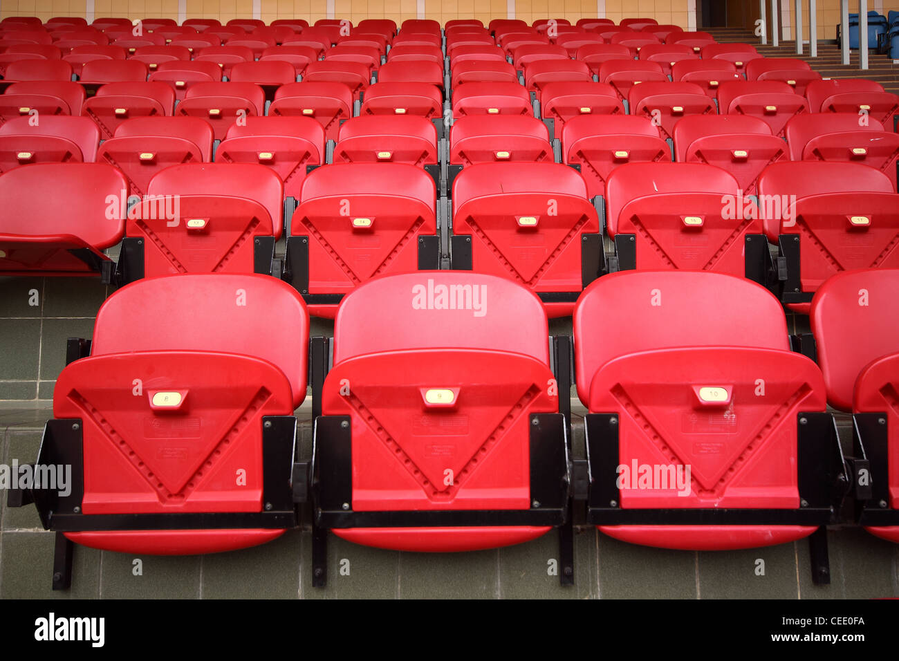 Bright red stadium seats Stock Photo - Alamy