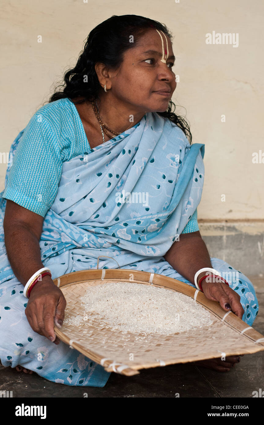 Woman sifting rice hi-res stock photography and images - Alamy
