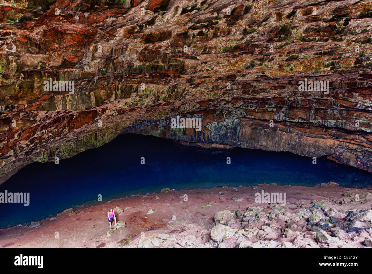 Waikapalae wet cave with female hiker in Haena State Park, Kauai ...
