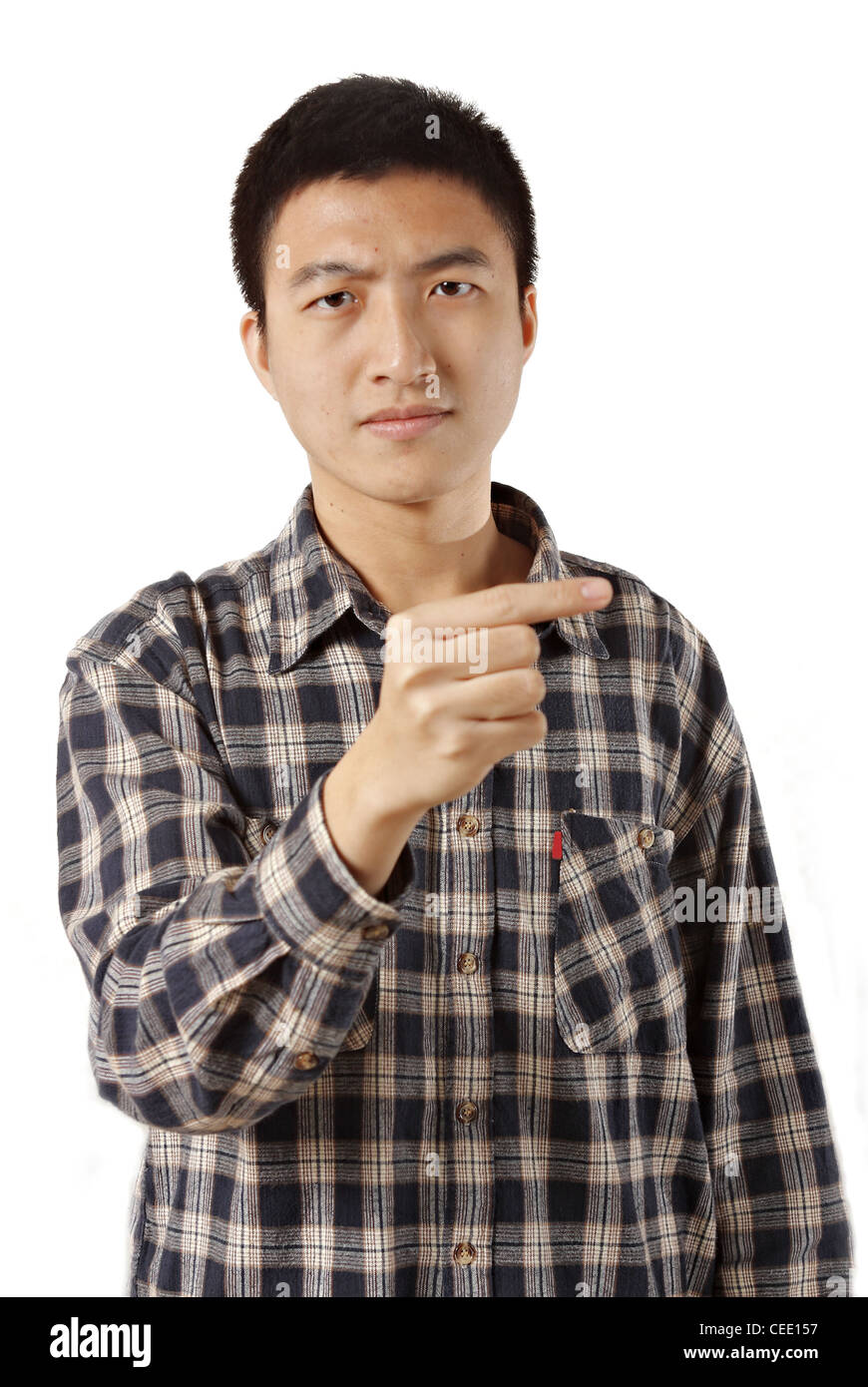 Casual young man pointing left Stock Photo - Alamy