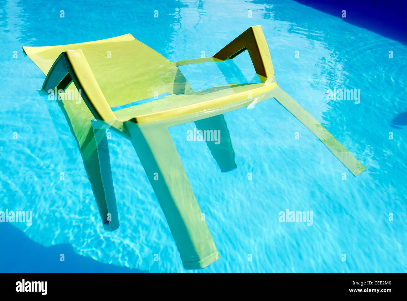 A cool chair floating in swimming pool Stock Photo - Alamy