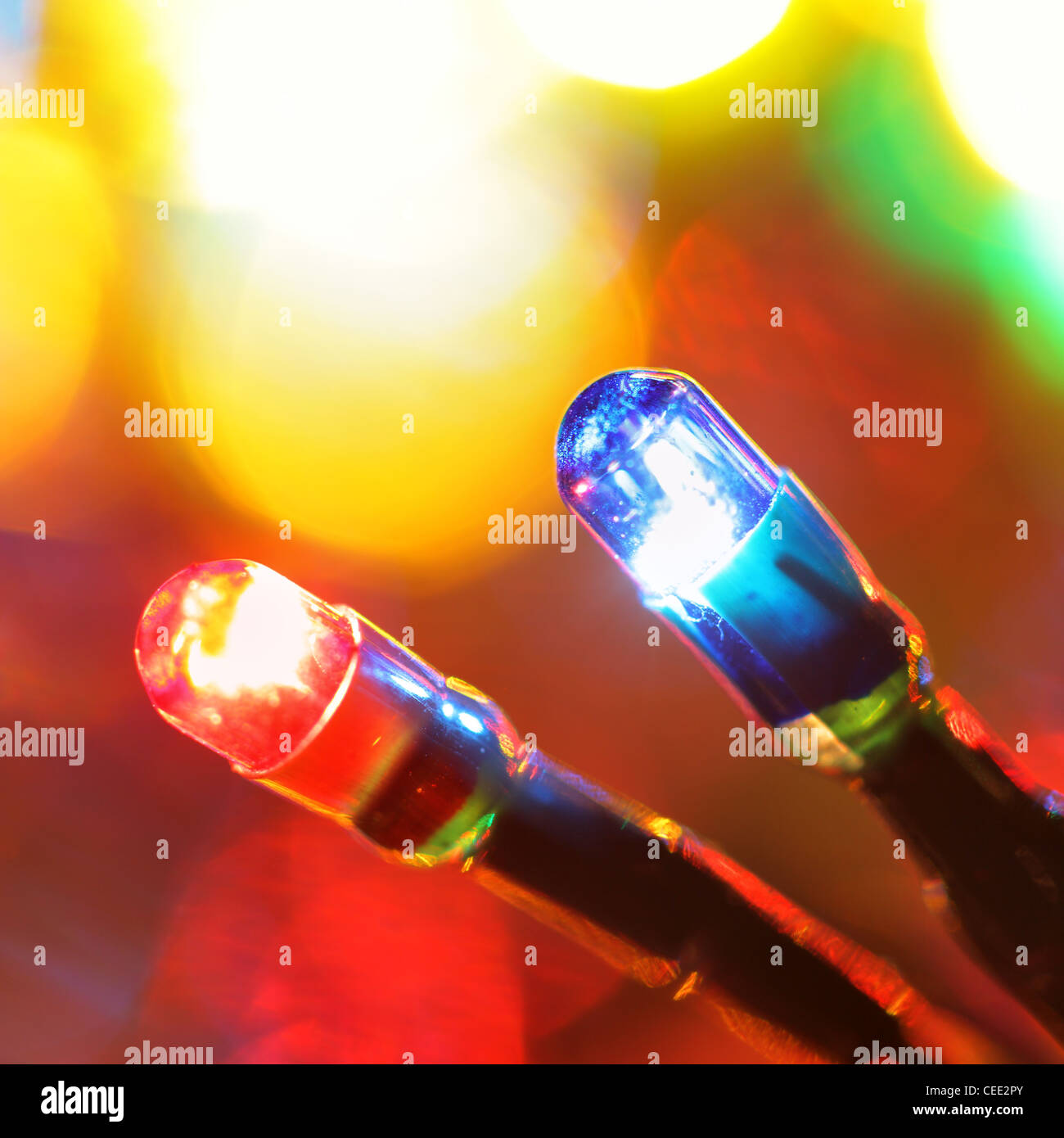 Colorful electric light bulbs and lights out of focus Stock Photo - Alamy