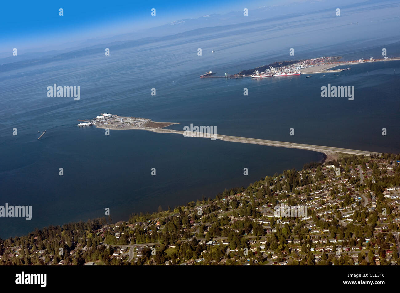 Sea with a path and commercial port Stock Photo - Alamy