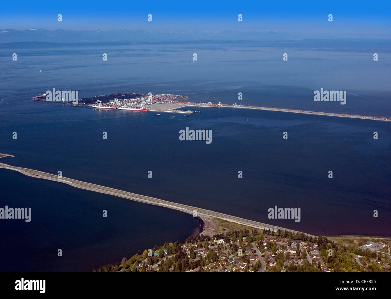 Sea with a path and commercial port Stock Photo - Alamy